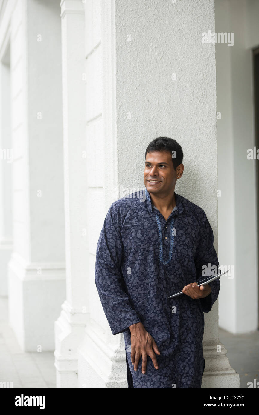 Happy indian man outdoors. portrait of an indian man wearing a ...