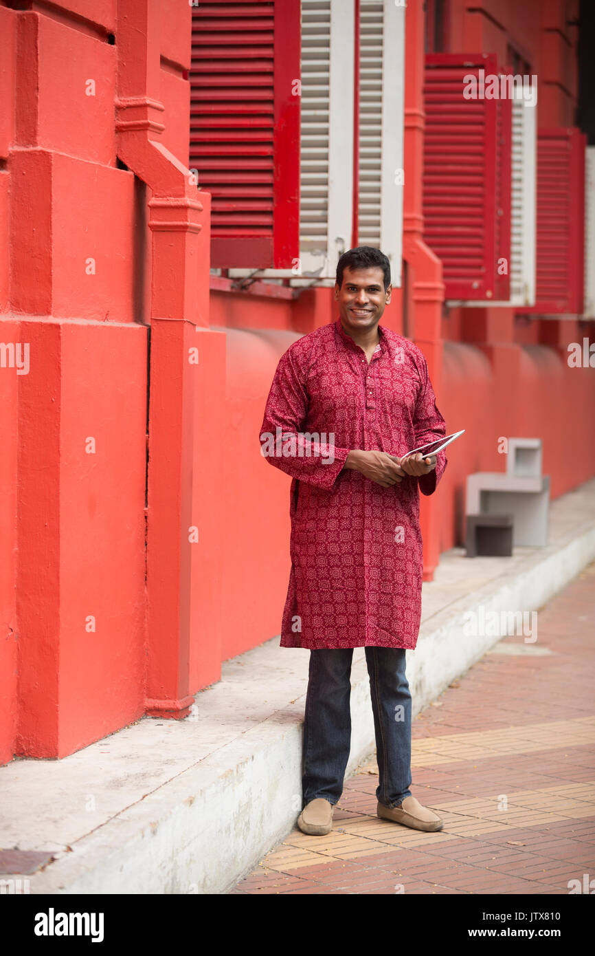 Happy indian man outdoors. portrait of an indian man wearing a ...