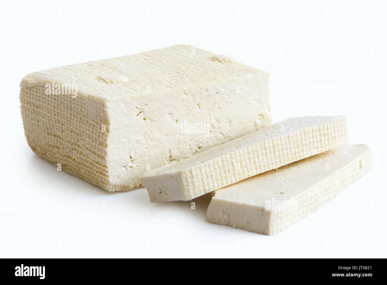 Block of white tofu and two slices isolated on white Stock Photo - Alamy