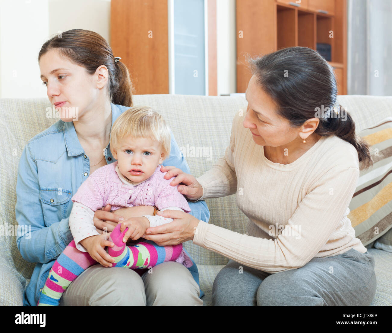 Daughter comforting senior parent hi-res stock photography and images ...