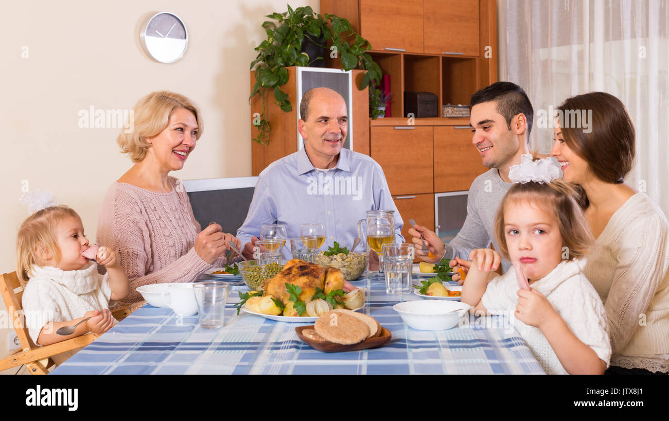 Multigenerational family sitting table hi-res stock photography and ...