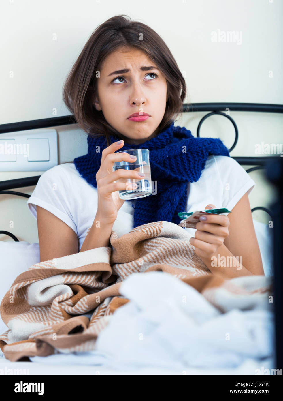 Sad teenage girl with high fever and flu in bed Stock Photo - Alamy