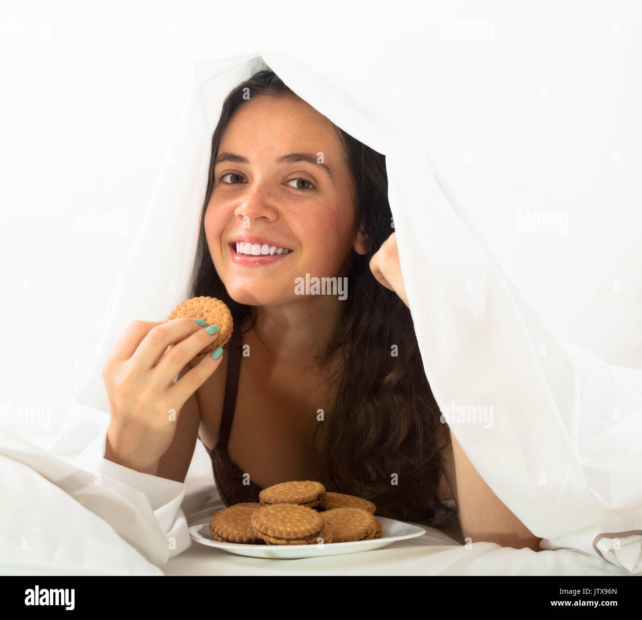Girl eating sweet chocolate chip hi-res stock photography and images ...