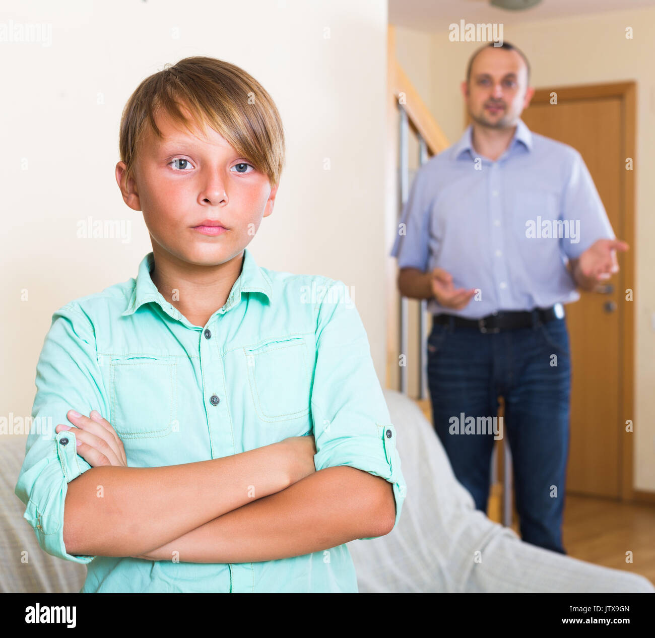 Unhappy son having domestic quarrel with father Stock Photo - Alamy