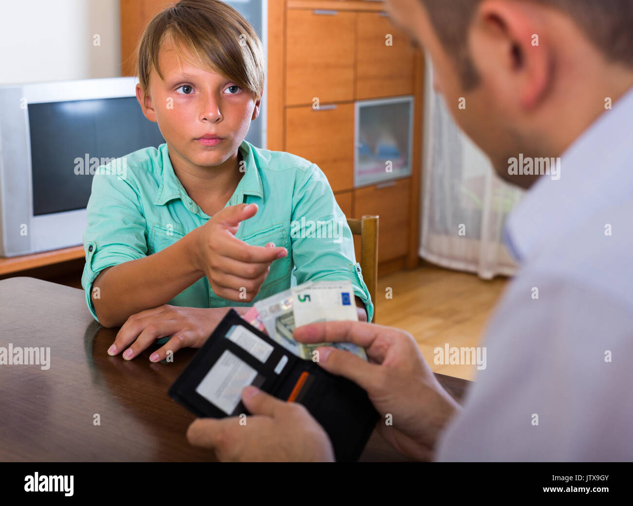 Teen asking parent for money hi-res stock photography and images - Alamy
