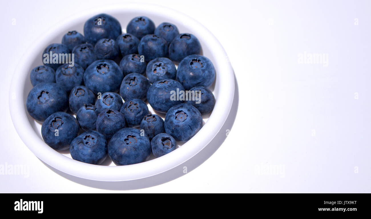 Blueberry. Close-up view of fresh Blueberries isolated on white ...