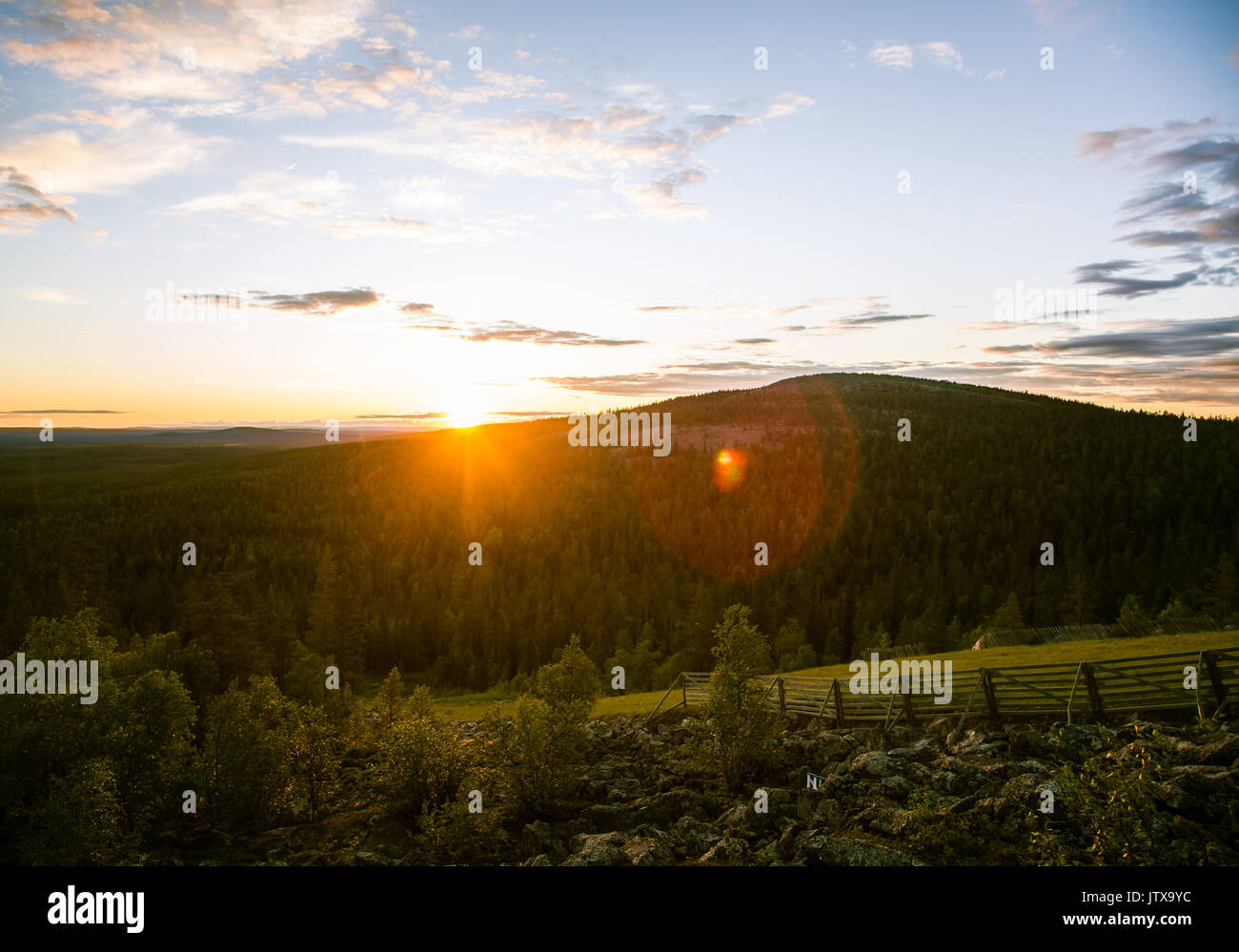 A beautiful landscape with a midnight sun above arctic circle. Dreamy ...