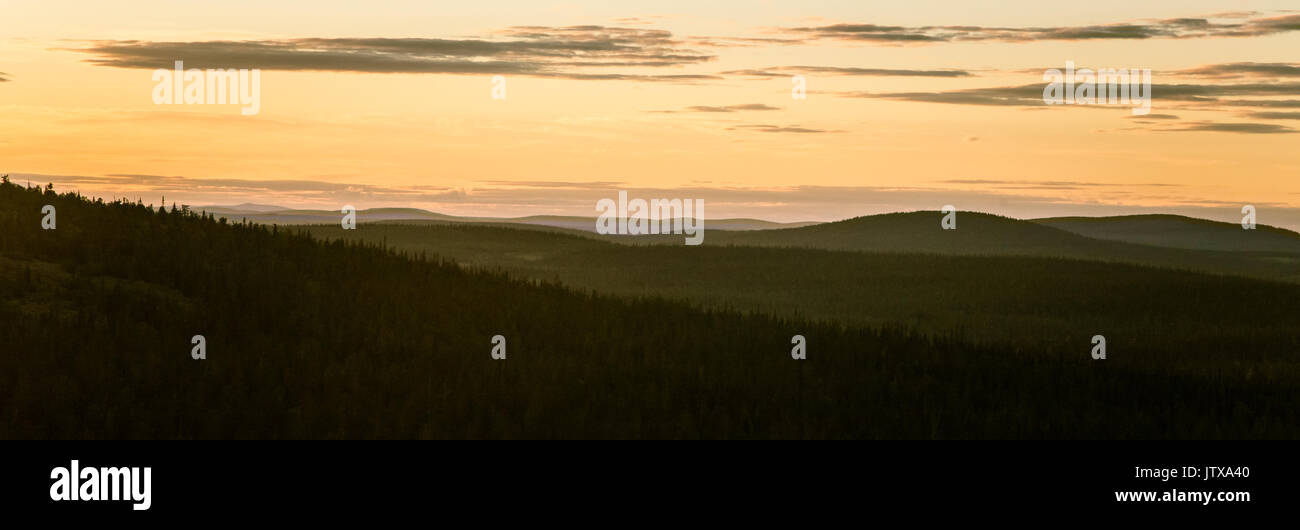 A beautiful landscape with a midnight sun above arctic circle. Dreamy ...