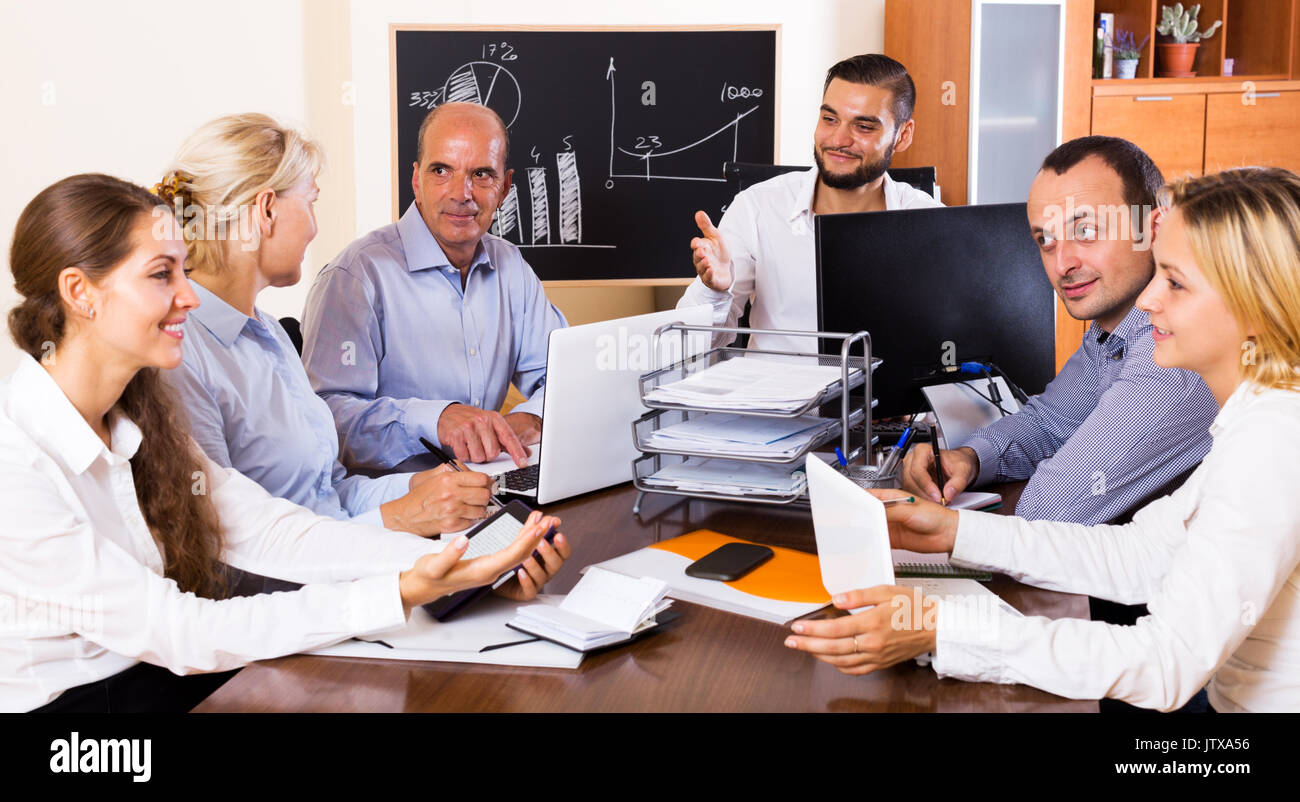 Office staff gathered in the conference hall for the meeting Stock ...