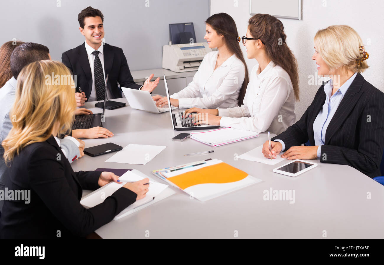 Chief with professional happy spanish officials discussing preparing ...