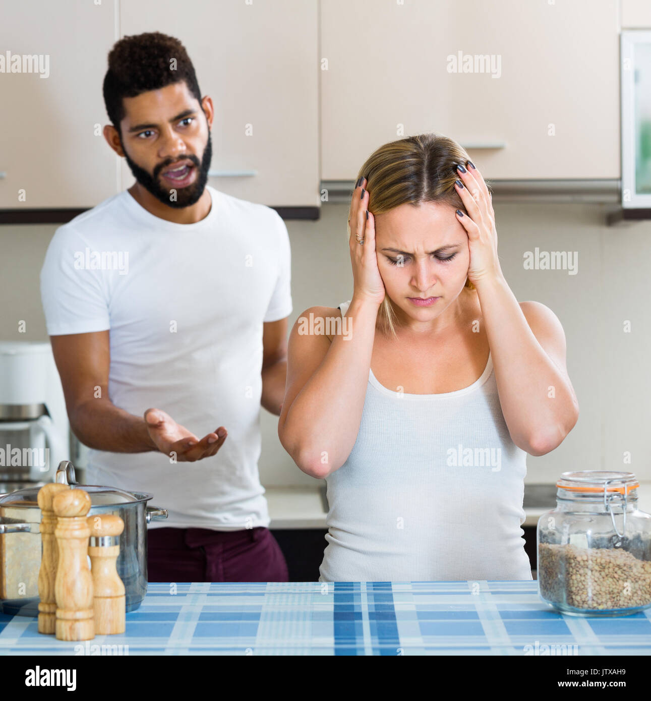 Upset black man and frustrated housewife having bad argument Stock ...