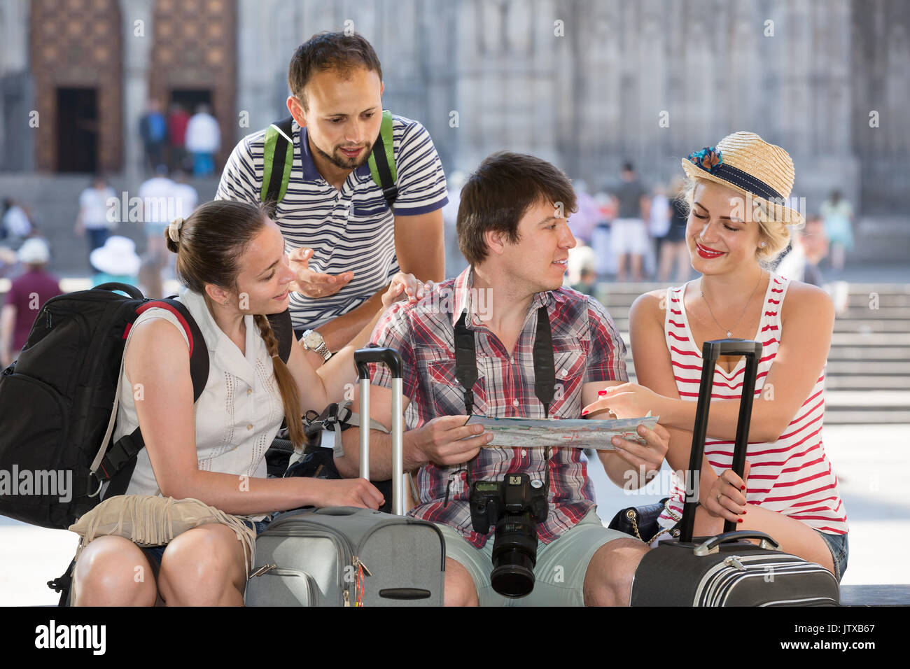 young american tourists with map exploring the city destination Stock ...