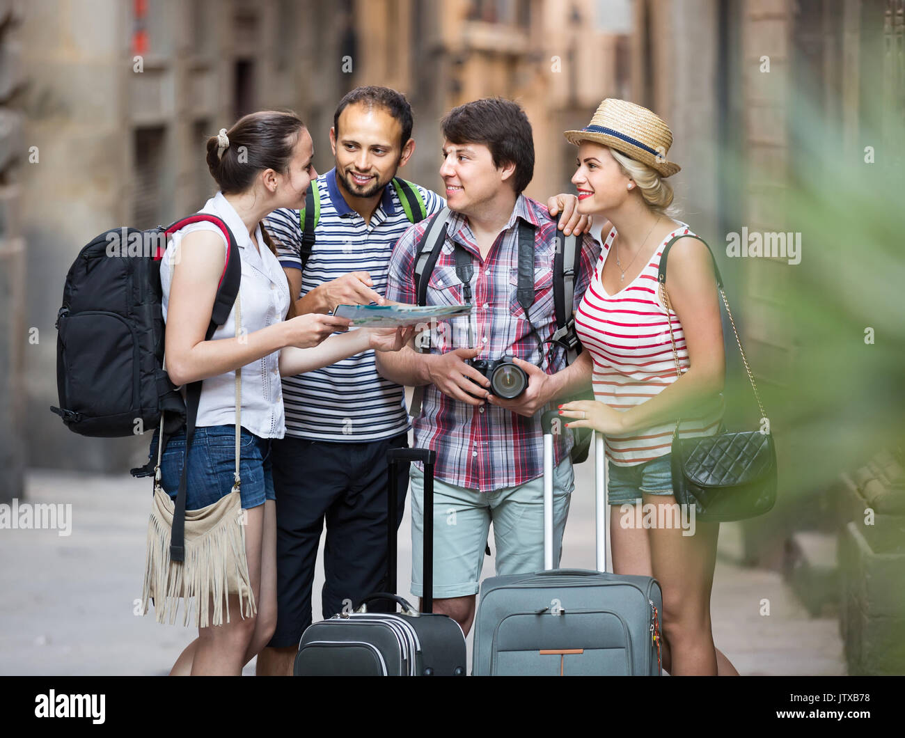 happy russian tourists with map exploring the city destination Stock ...