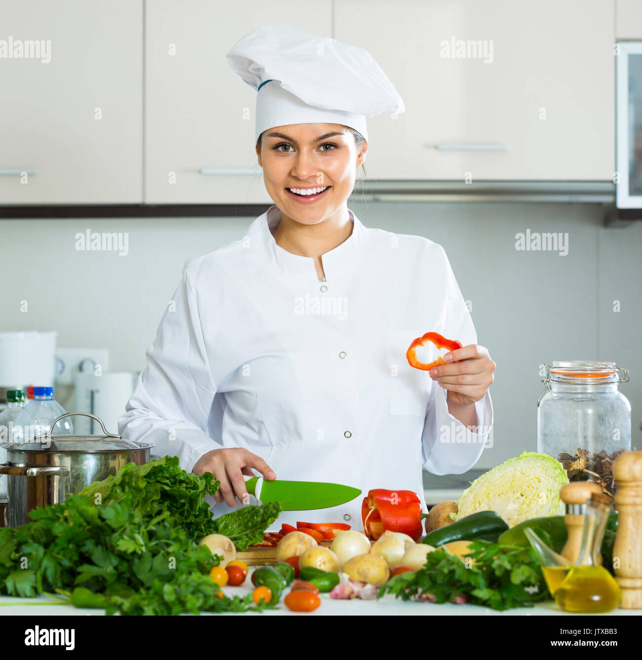 Happy woman cook preparing vegetarian meal at home Stock Photo - Alamy