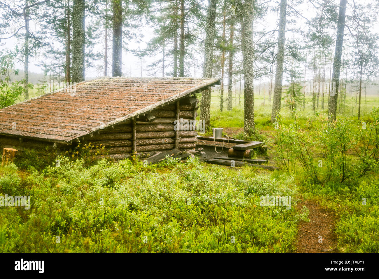 A beautiful small wooden building in the middle of Finnish forest Stock ...