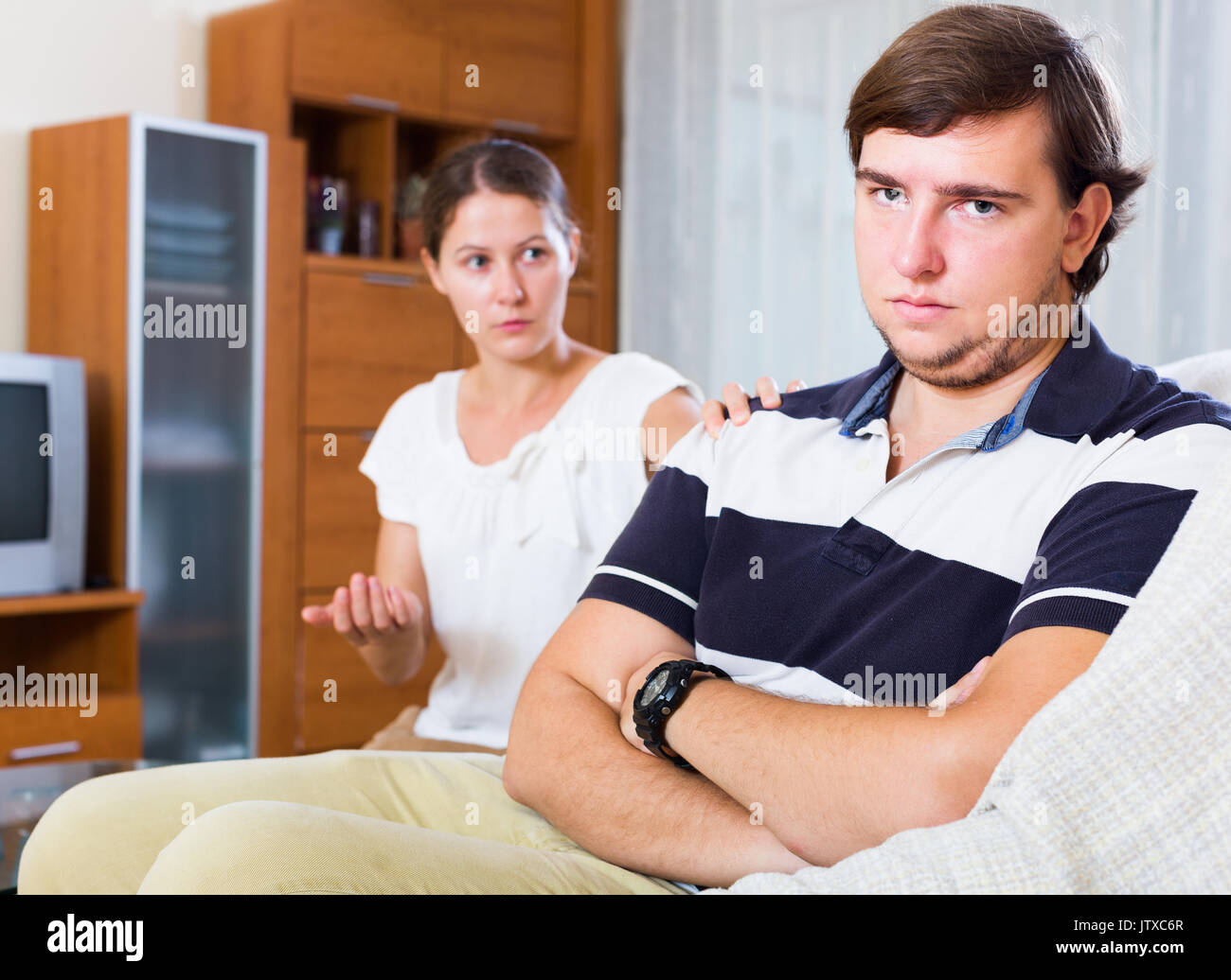 Woman trying to console man hi-res stock photography and images - Alamy