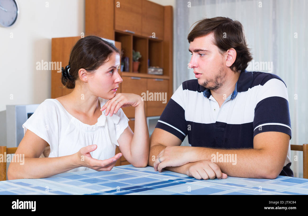 Couple talking seriously indoor hi-res stock photography and images - Alamy