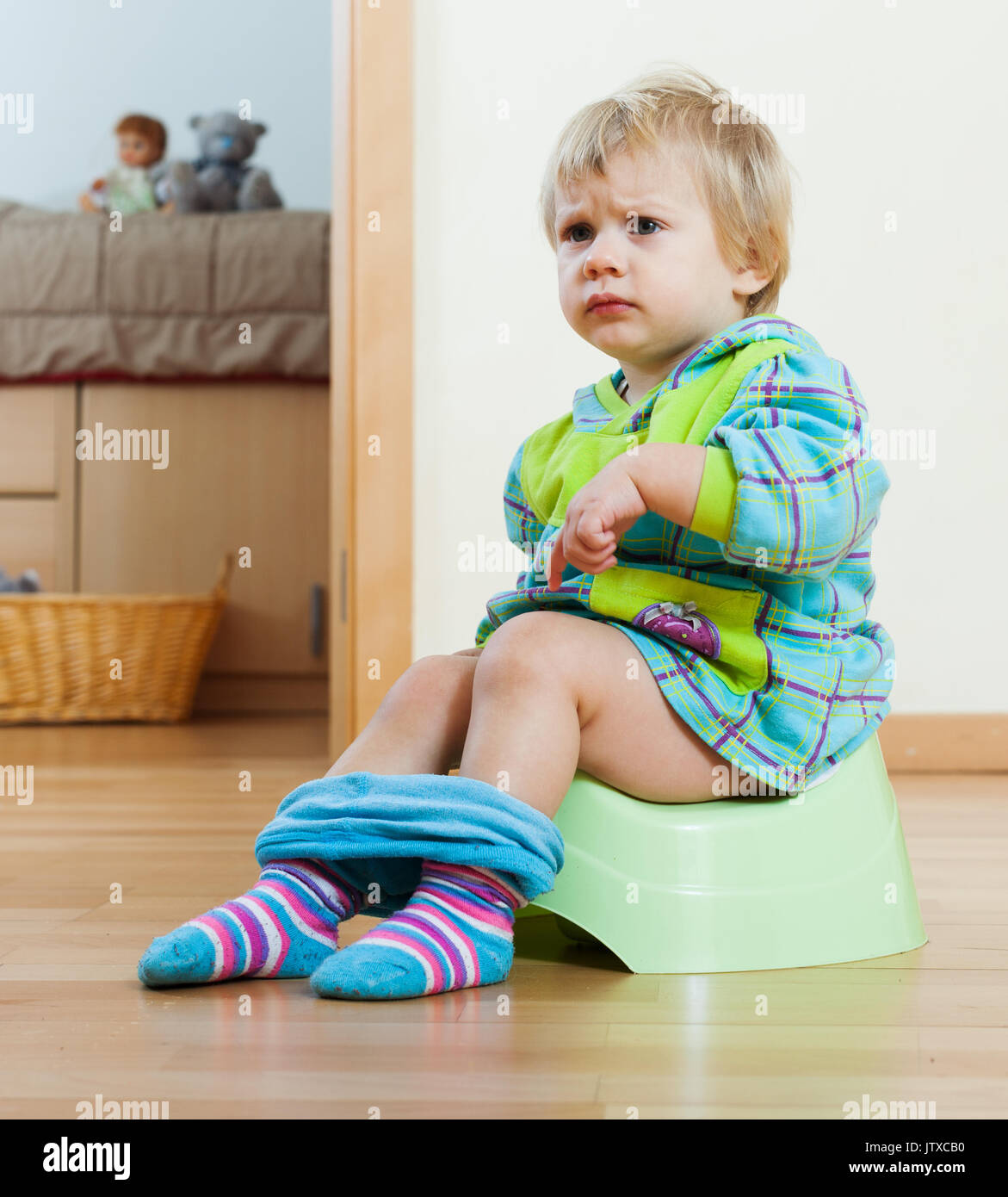 Toddler sitting on potty in home Stock Photo - Alamy