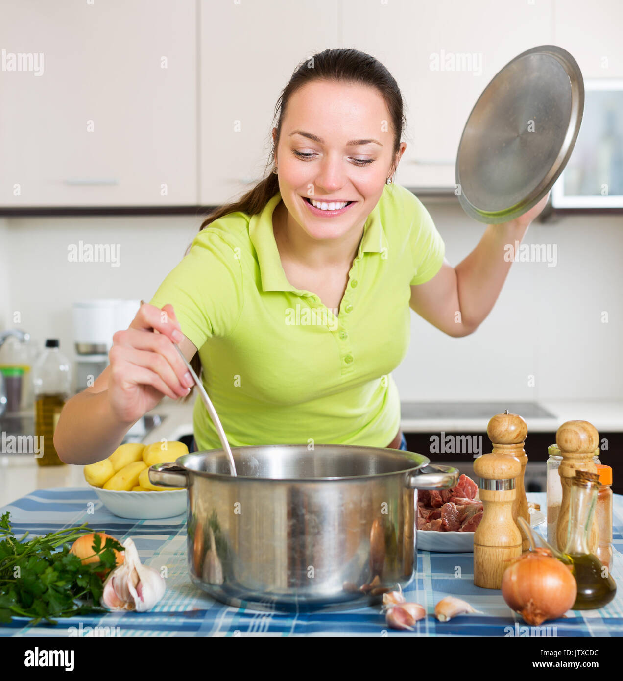 Woman cooking soup hi-res stock photography and images - Alamy