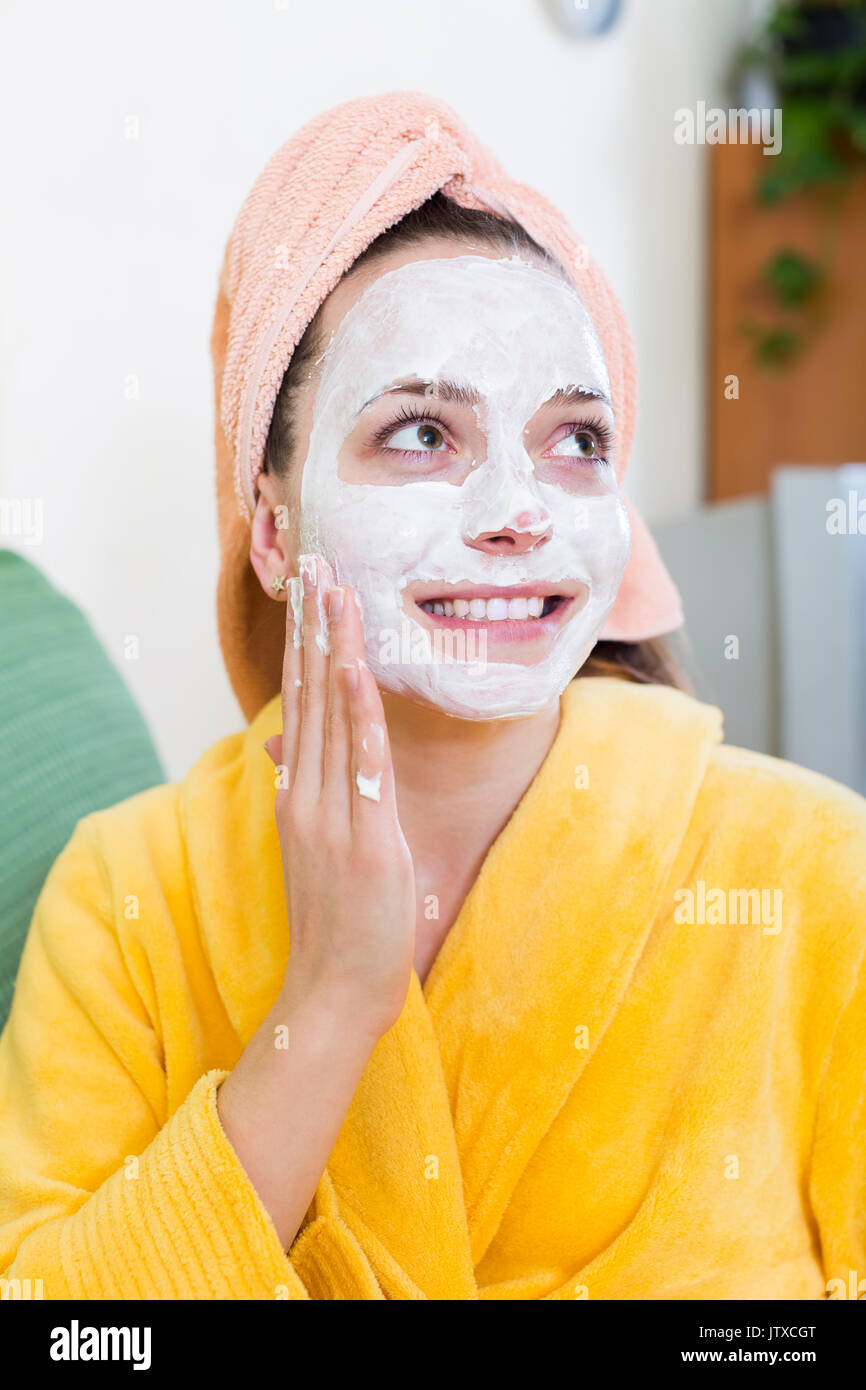 Girl with face pack relaxing on sofa indoors Stock Photo - Alamy