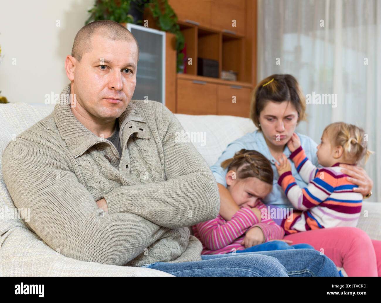 Family with children having serious conflict at home Stock Photo - Alamy