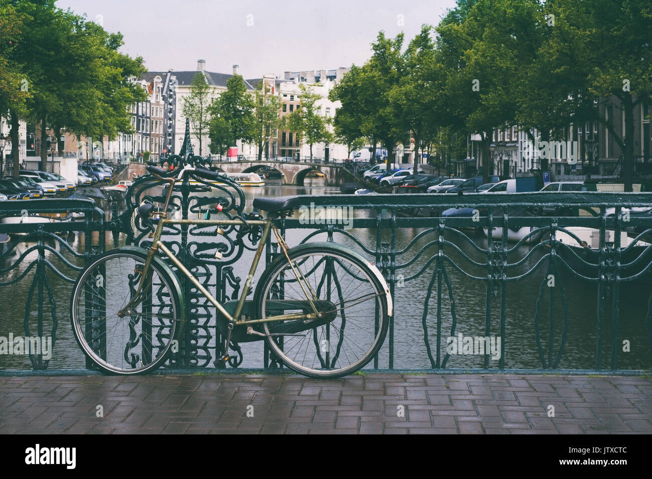 Bike on the bridge in Amsterdam Netherlands Stock Photo - Alamy