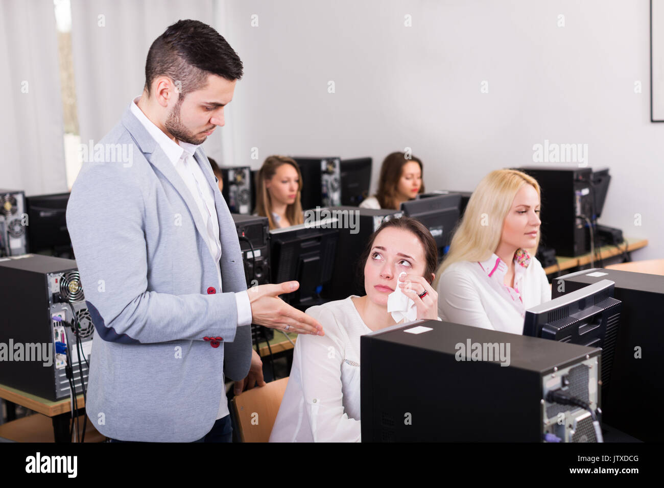 Furious manager scolding upset office worker Stock Photo - Alamy