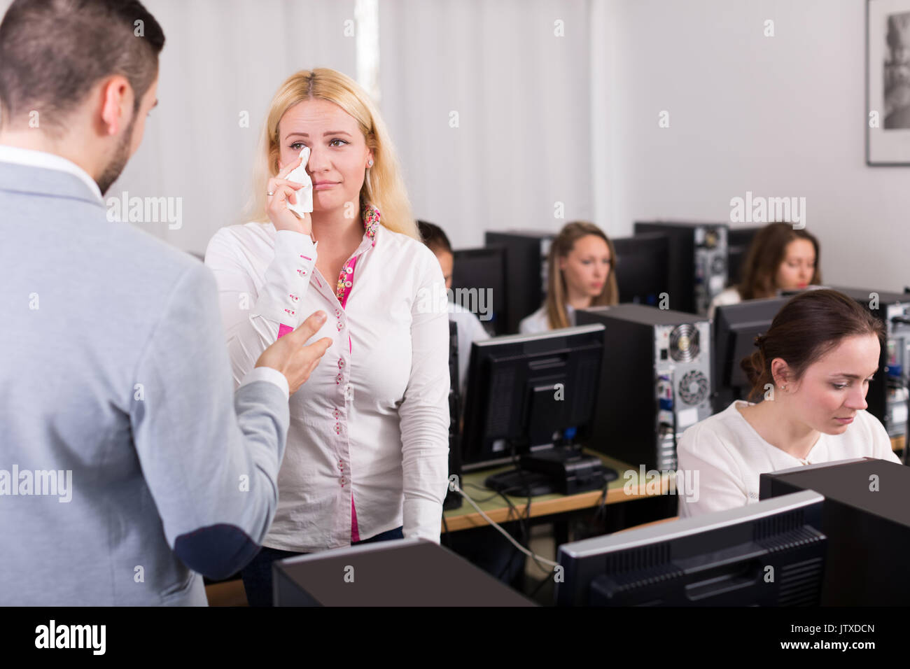 Strict boss and crying american clerk at open space working area Stock ...