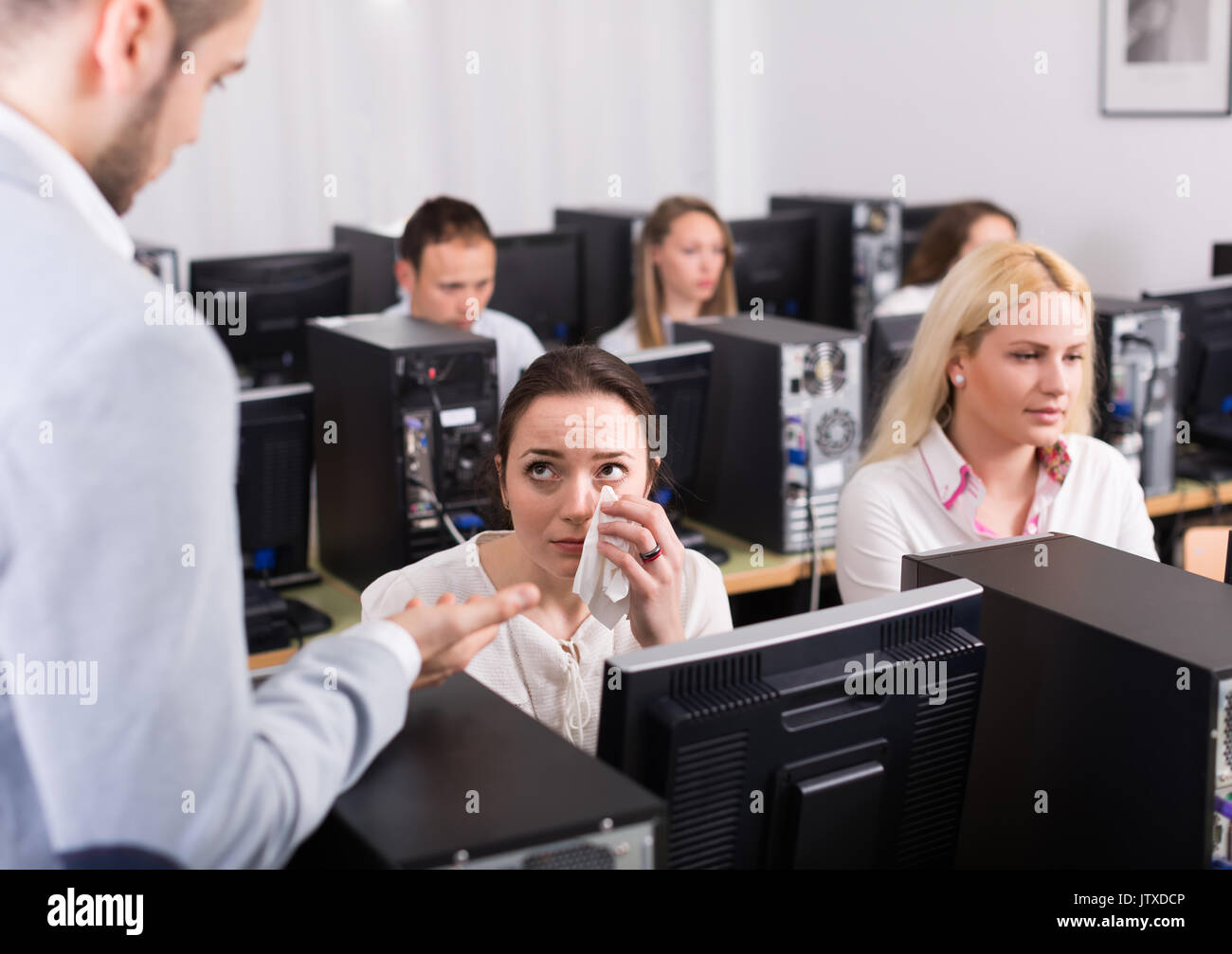 Furious supervisor scolding crying office worker Stock Photo - Alamy