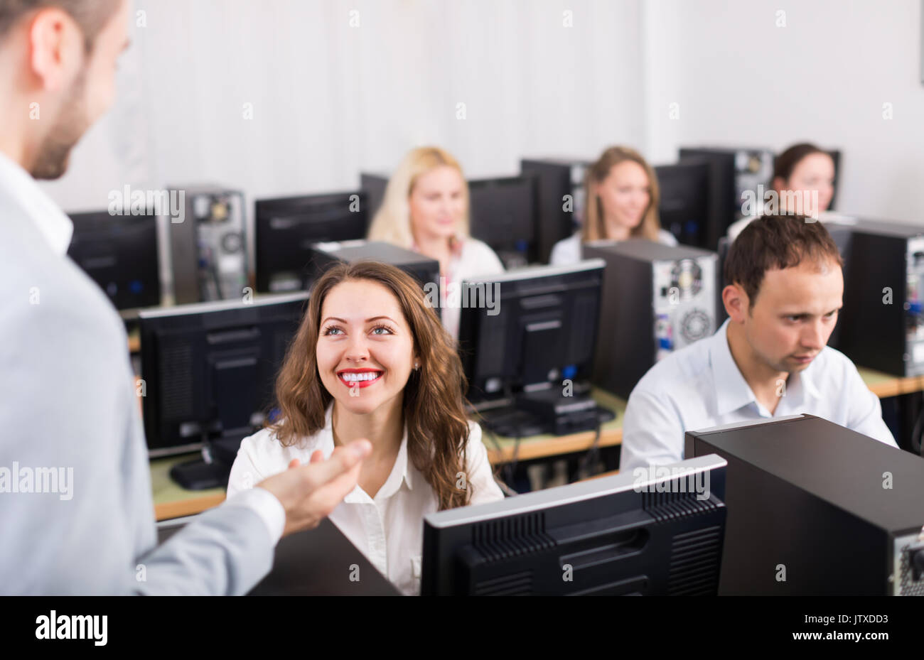 Satisfied customer service manager and smiling employee at office Stock ...