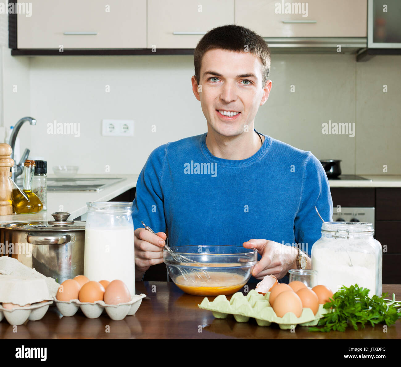 Man cooking scrambled eggs hi-res stock photography and images - Alamy