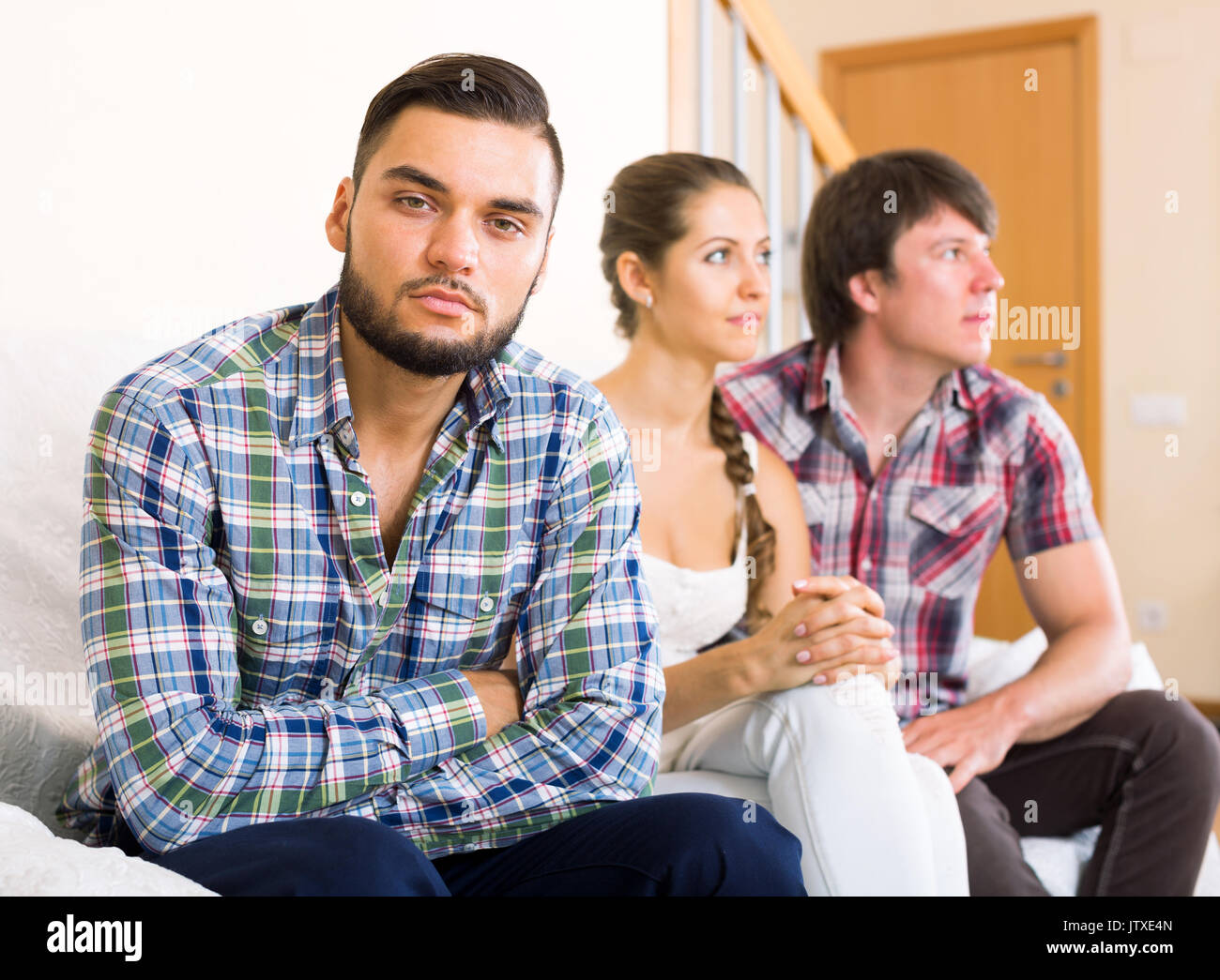 portrait young unhappy man in polygamous family indoors Stock Photo - Alamy