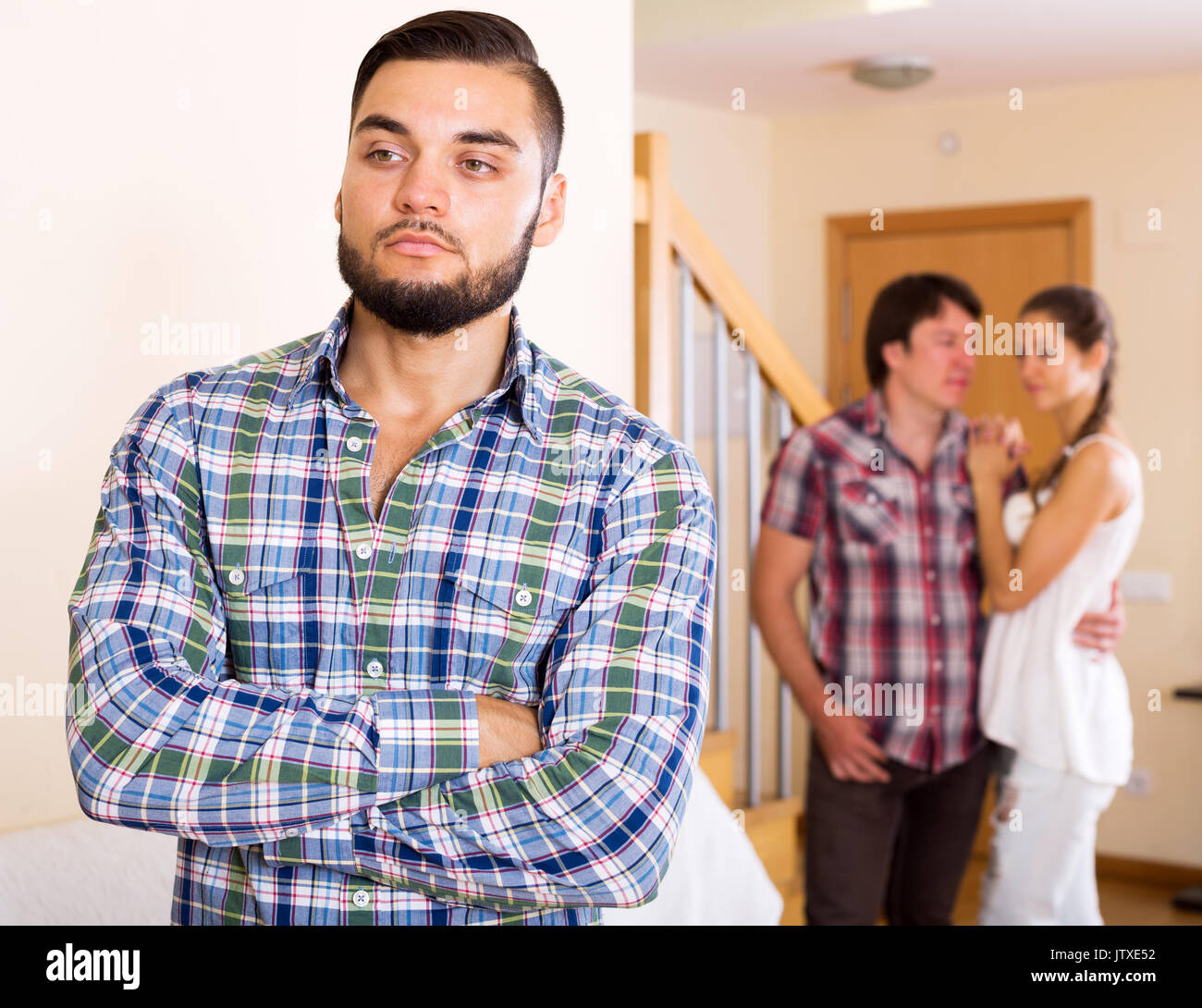 conflict in adult polygamous family indoors in the living room Stock ...