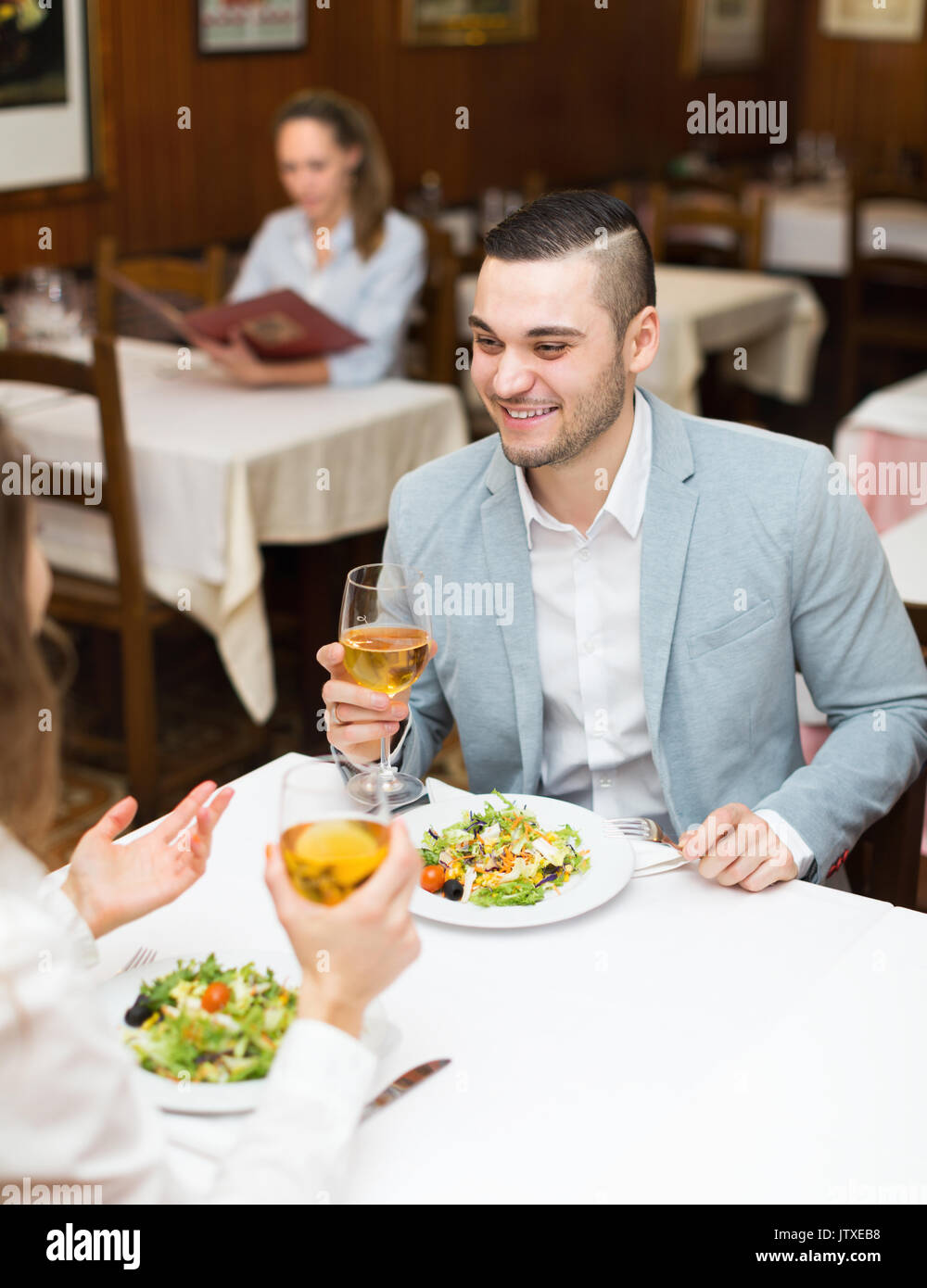 Young happy man having romantic dinner with girl in restaurant Stock ...