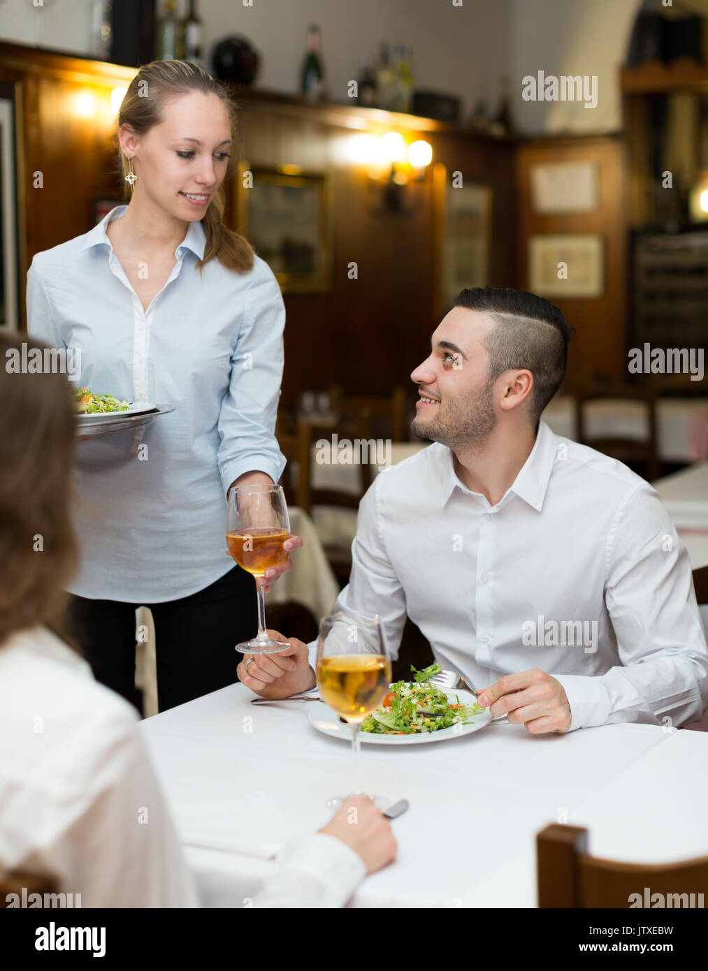Portrait of happy girl working in the modern bar as waitress Stock ...