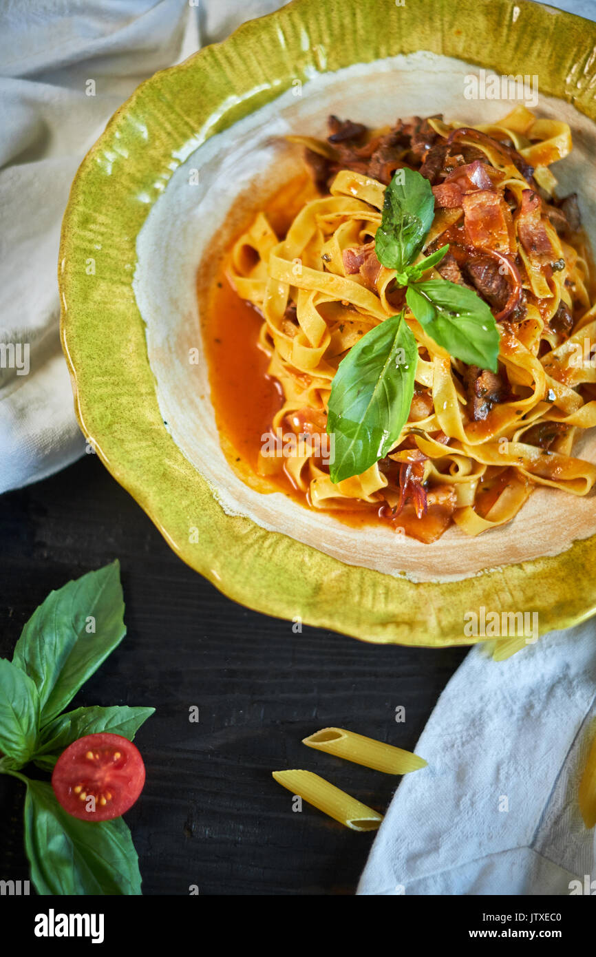 Italian penne pasta with tomatoes and pesto in a restaurant jpg Stock ...