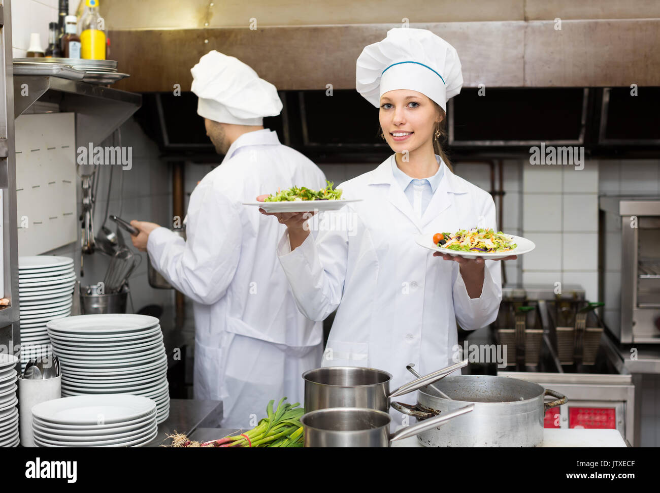 Two cooks team in restaurant hi-res stock photography and images - Alamy