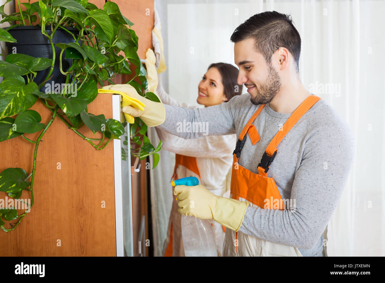 Portrait of cleaning premises team is ready to work in room Stock Photo ...
