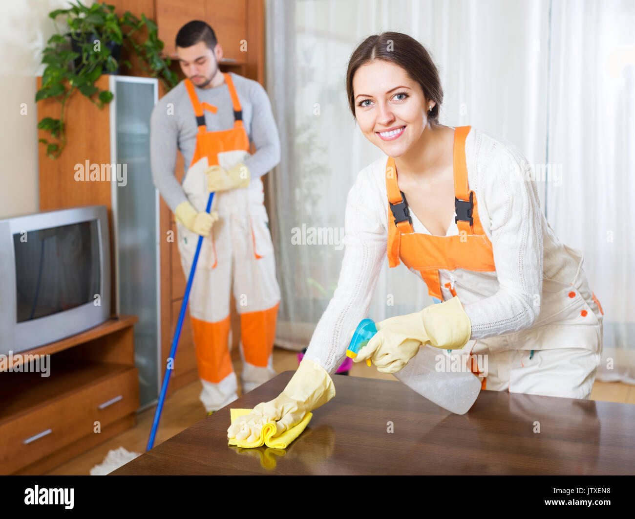 Cleaning premises smiling team is ready to work Stock Photo - Alamy