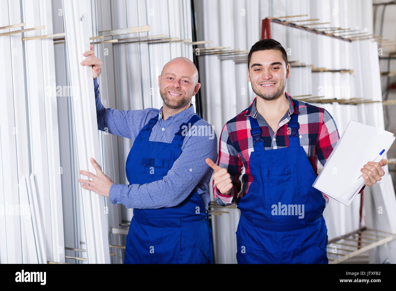 Factory workers operating pvc frame hi-res stock photography and images ...