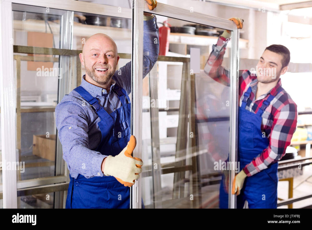 workmen with windows production at modern factory Stock Photo - Alamy
