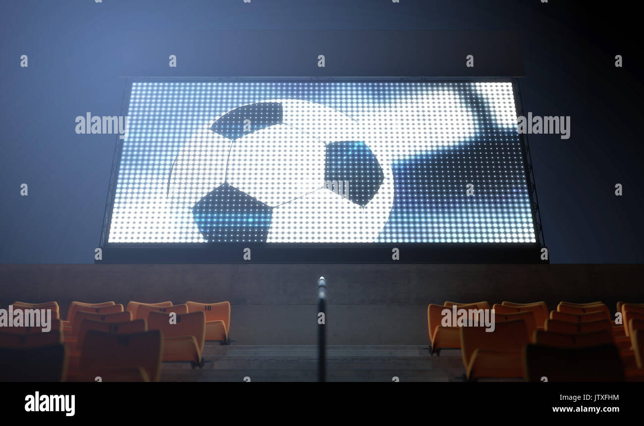 An illuminated stadium big screen showing a soccer replay in the stands ...