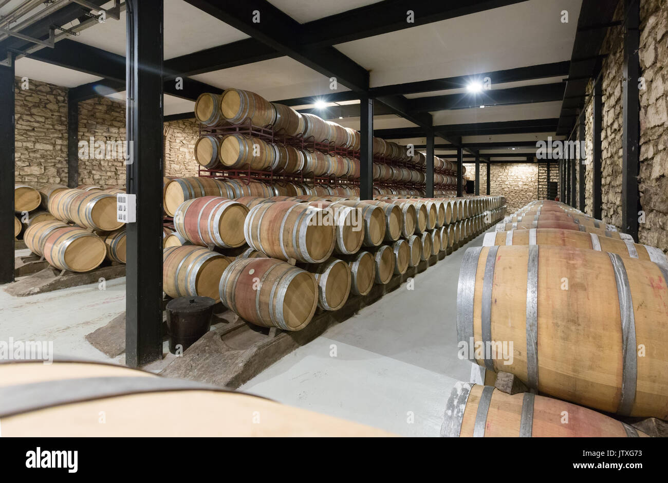 Rows of wooden barrels in winery factory Stock Photo - Alamy