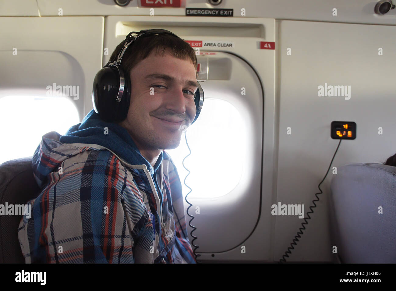 Smiling face airplane hi-res stock photography and images - Alamy