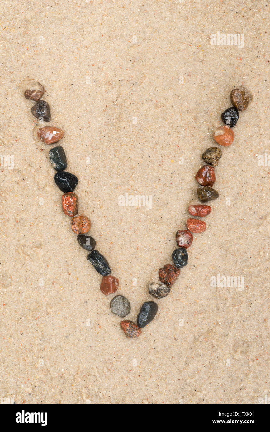 Alphabet writing on sand letter hi-res stock photography and images - Alamy