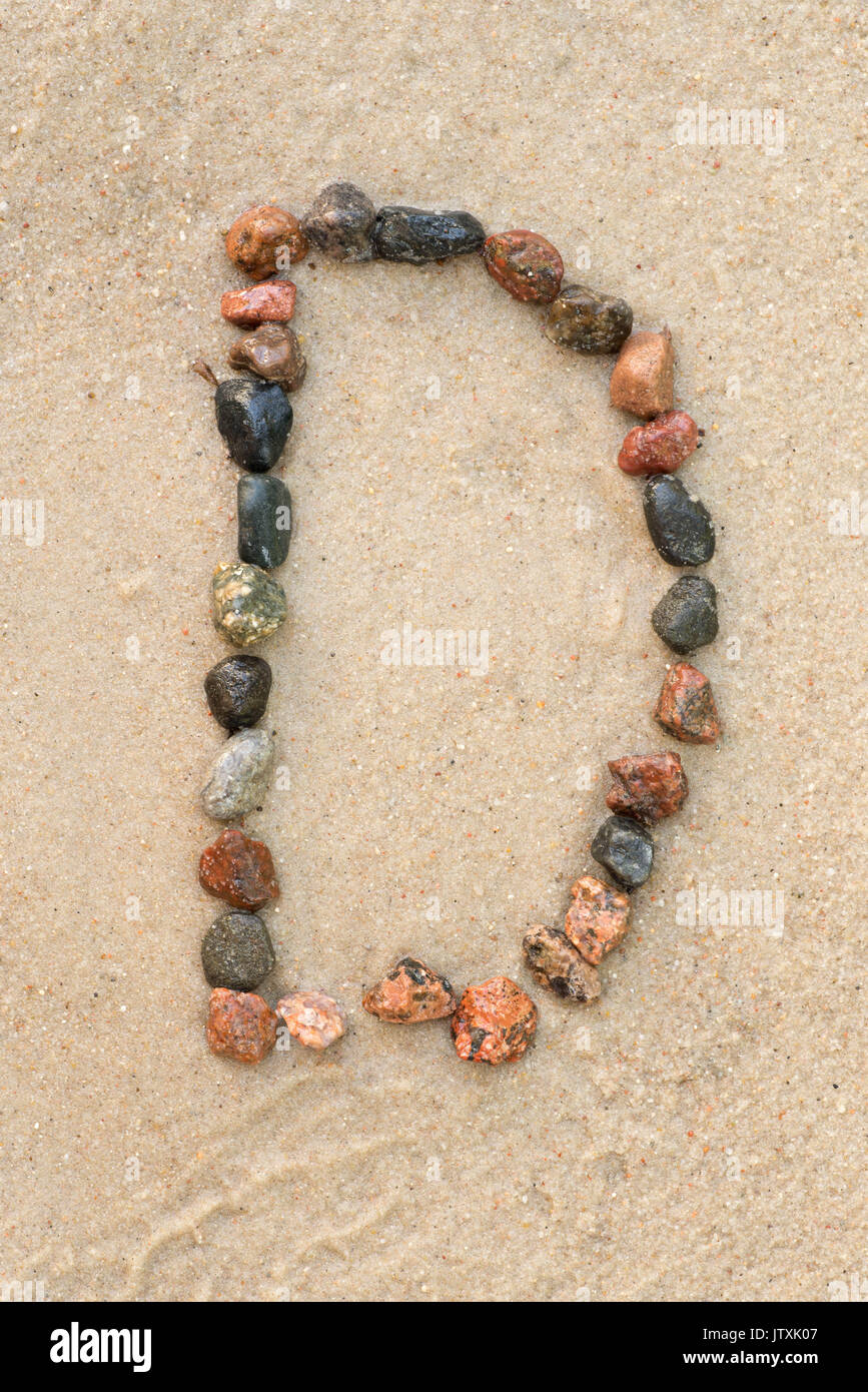 Alphabet writing on sand letter hi-res stock photography and images - Alamy