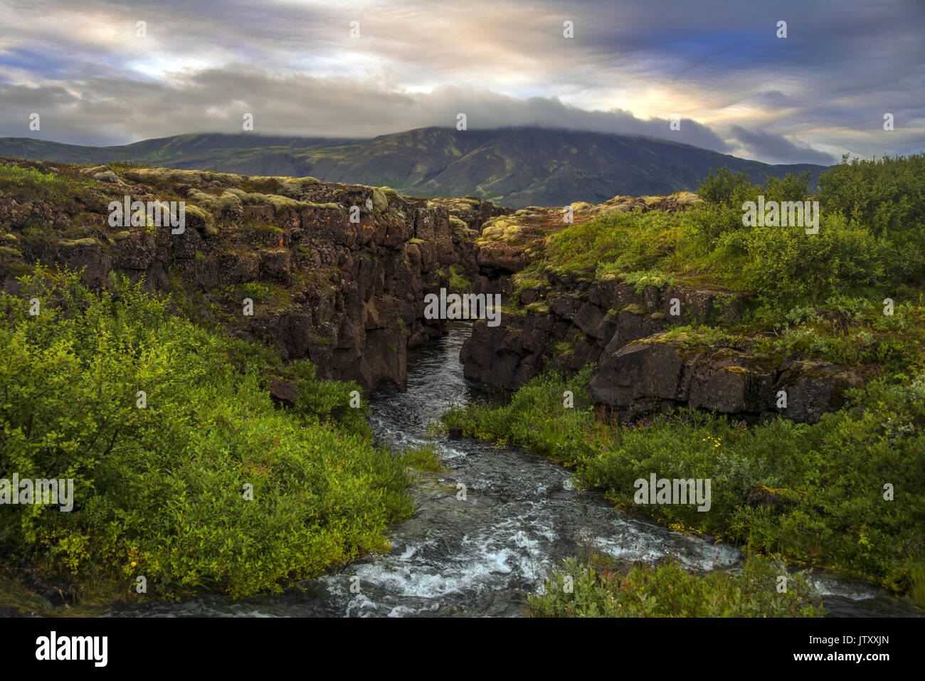 Small glacial run-off river amid the dramatic, volcanic, sub alpine ...