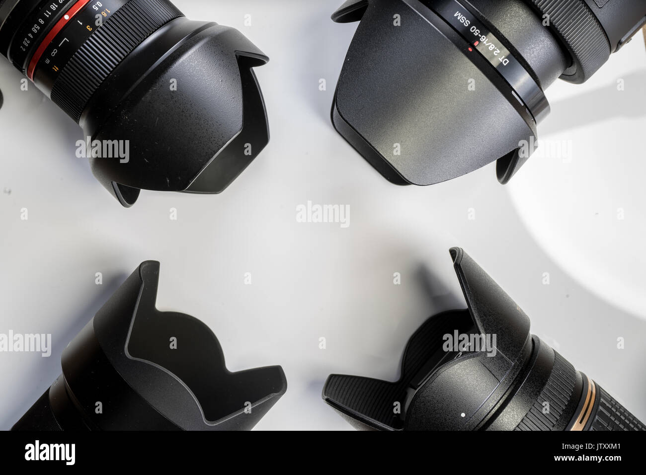 camera lenses laying on white background Stock Photo - Alamy