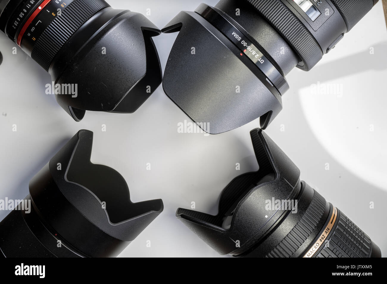camera lenses laying on white background Stock Photo - Alamy