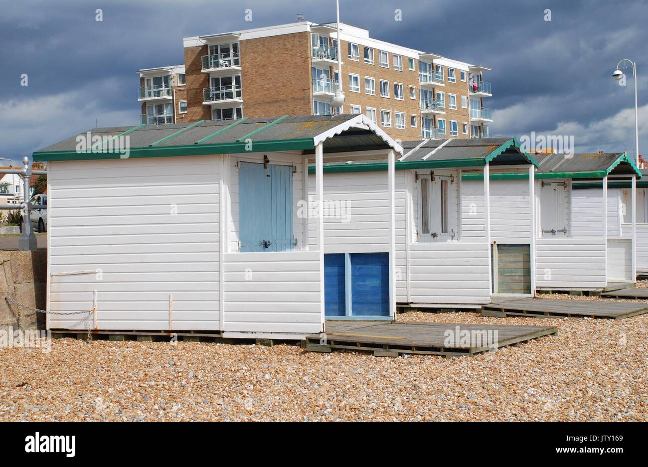 Traditional British beach huts on the beach at Bexhill-on-Sea in East ...